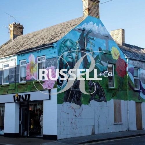 We have commissioned a full-building wrap-around mural to cover our ...